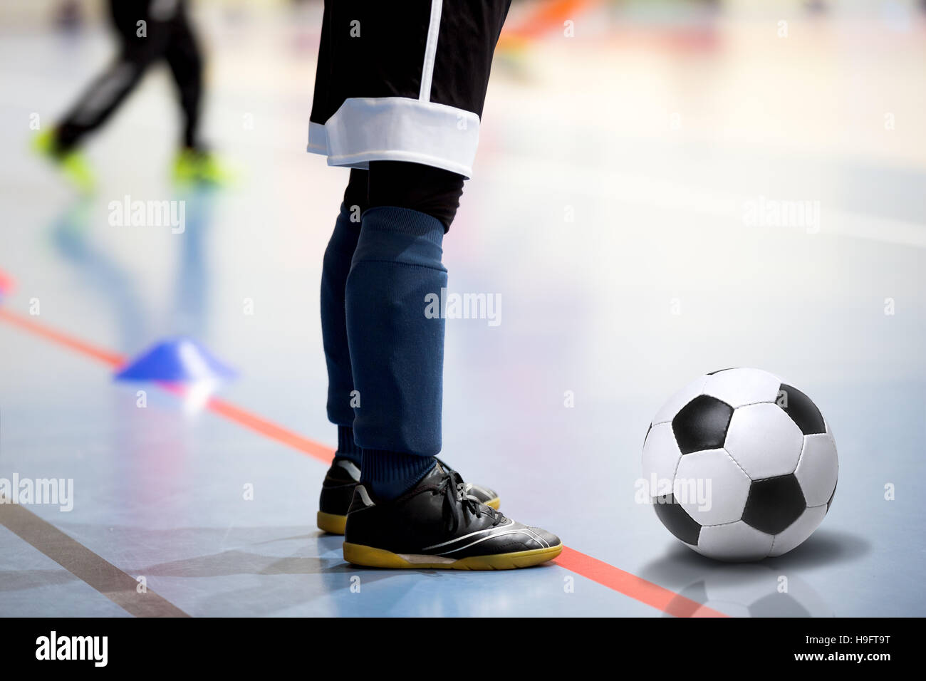 Football futsal training session. Futsal player with soccer ball ...