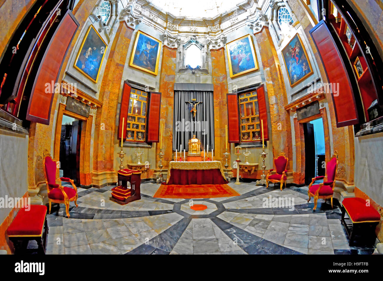 Cadiz cathedral side altar detail paintings and chairs Stock Photo - Alamy
