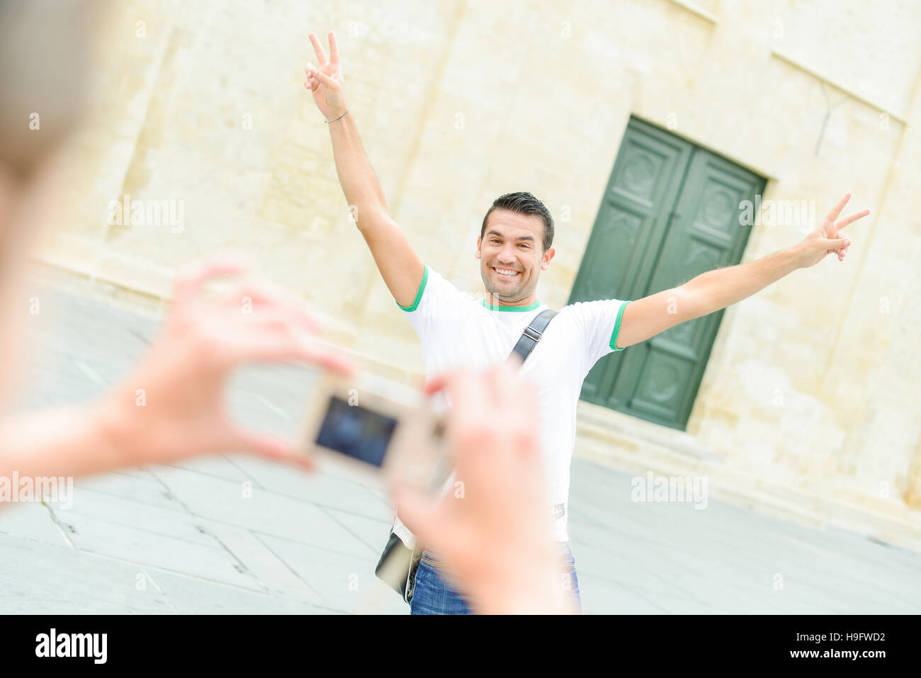 tourist posing for photo Stock Photo - Alamy