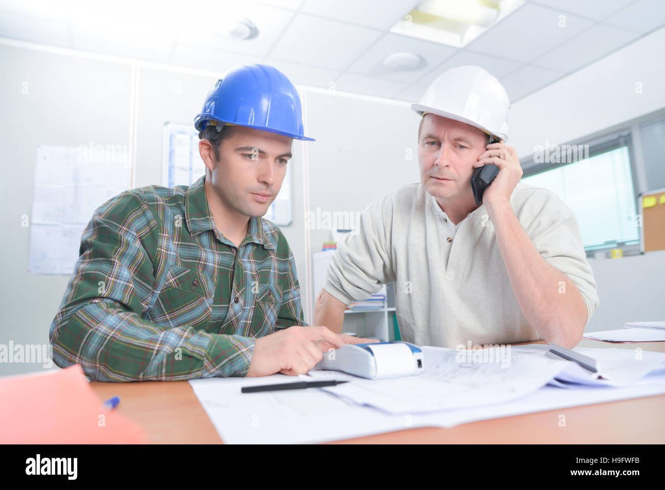 Architects working hard Stock Photo - Alamy