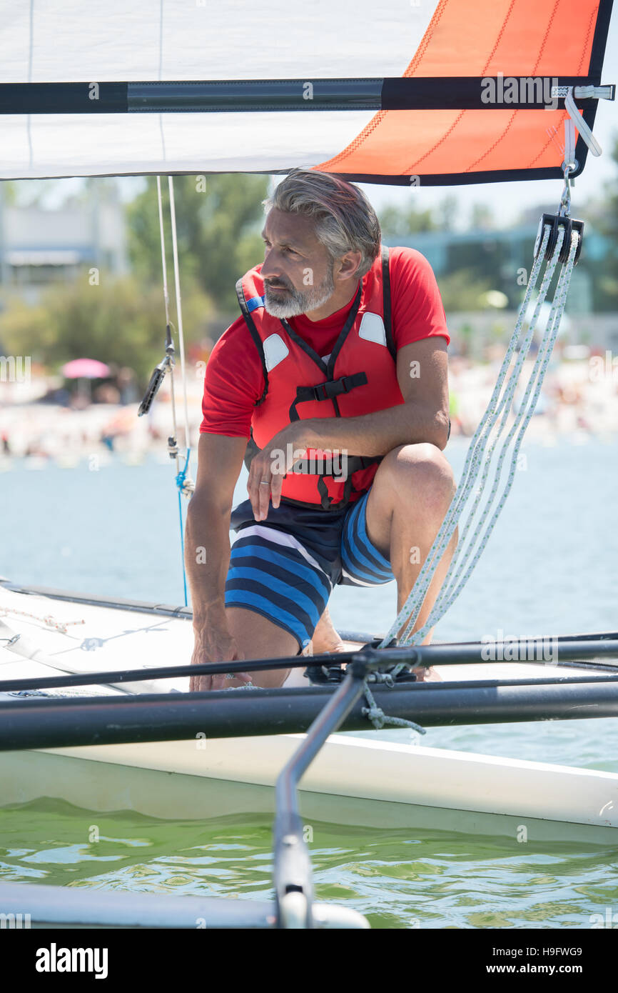 professional waterman training on lake with catamaran Stock Photo - Alamy