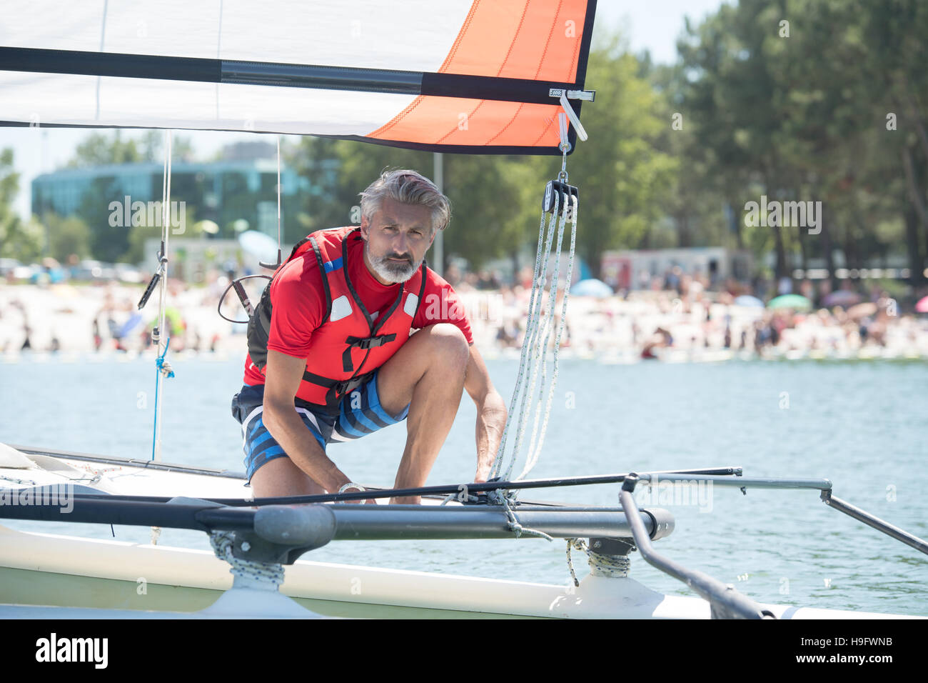 professional waterman training on lake with catamaran Stock Photo - Alamy