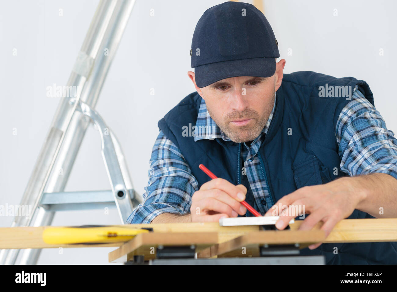 man drawing and modifying a house design Stock Photo - Alamy