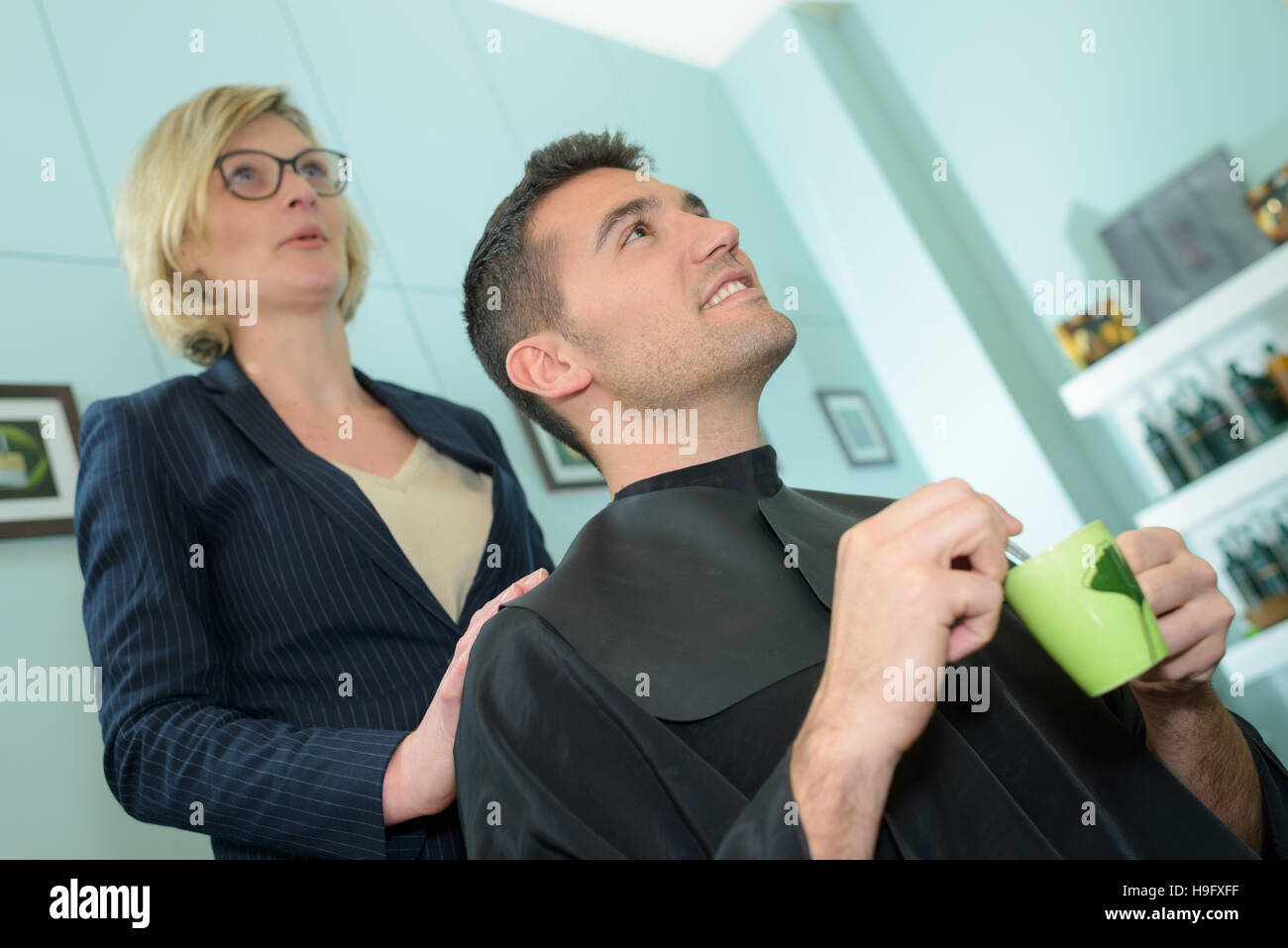 customer talking about cuts hair with hairdresser Stock Photo - Alamy