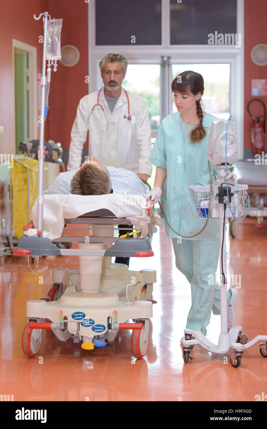 patient being transfered by nurse and doctor Stock Photo - Alamy