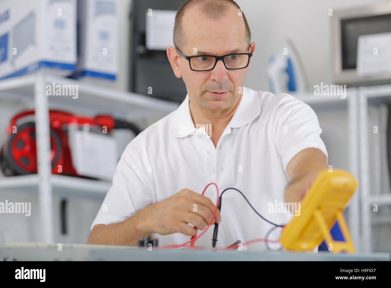 engineer calibrating a machine Stock Photo - Alamy