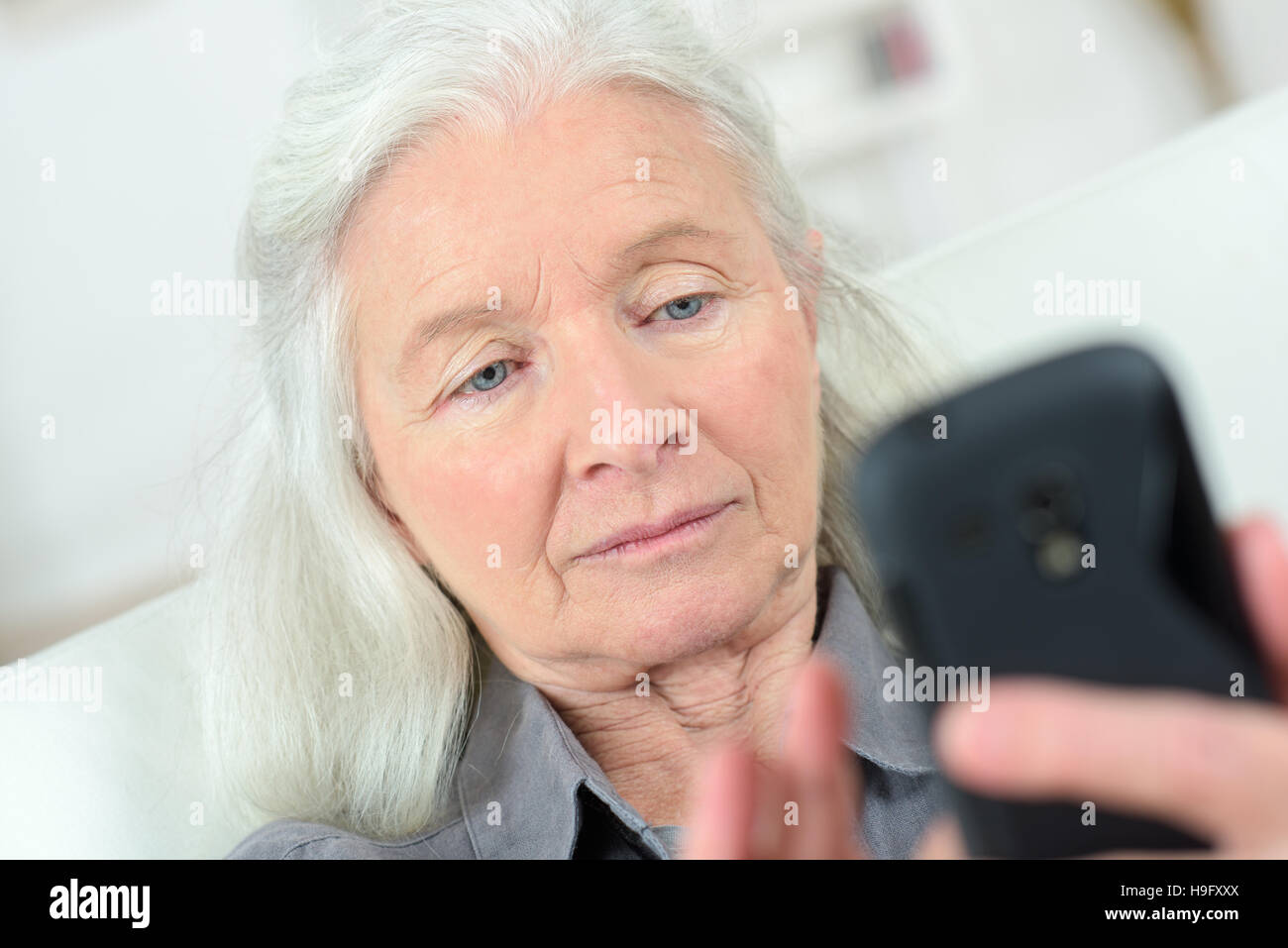 Grandma on mobile phone hi-res stock photography and images - Alamy
