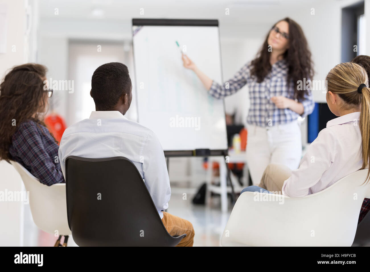 Businessman giving a presentation to his colleagues at work Stock Photo ...
