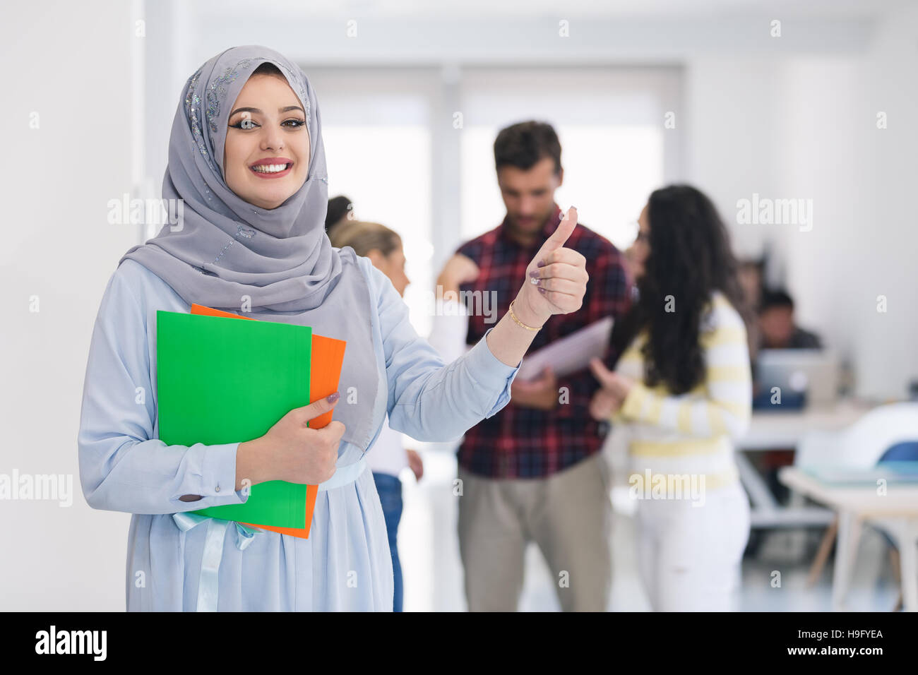 Arabic business woman working in team Stock Photo - Alamy