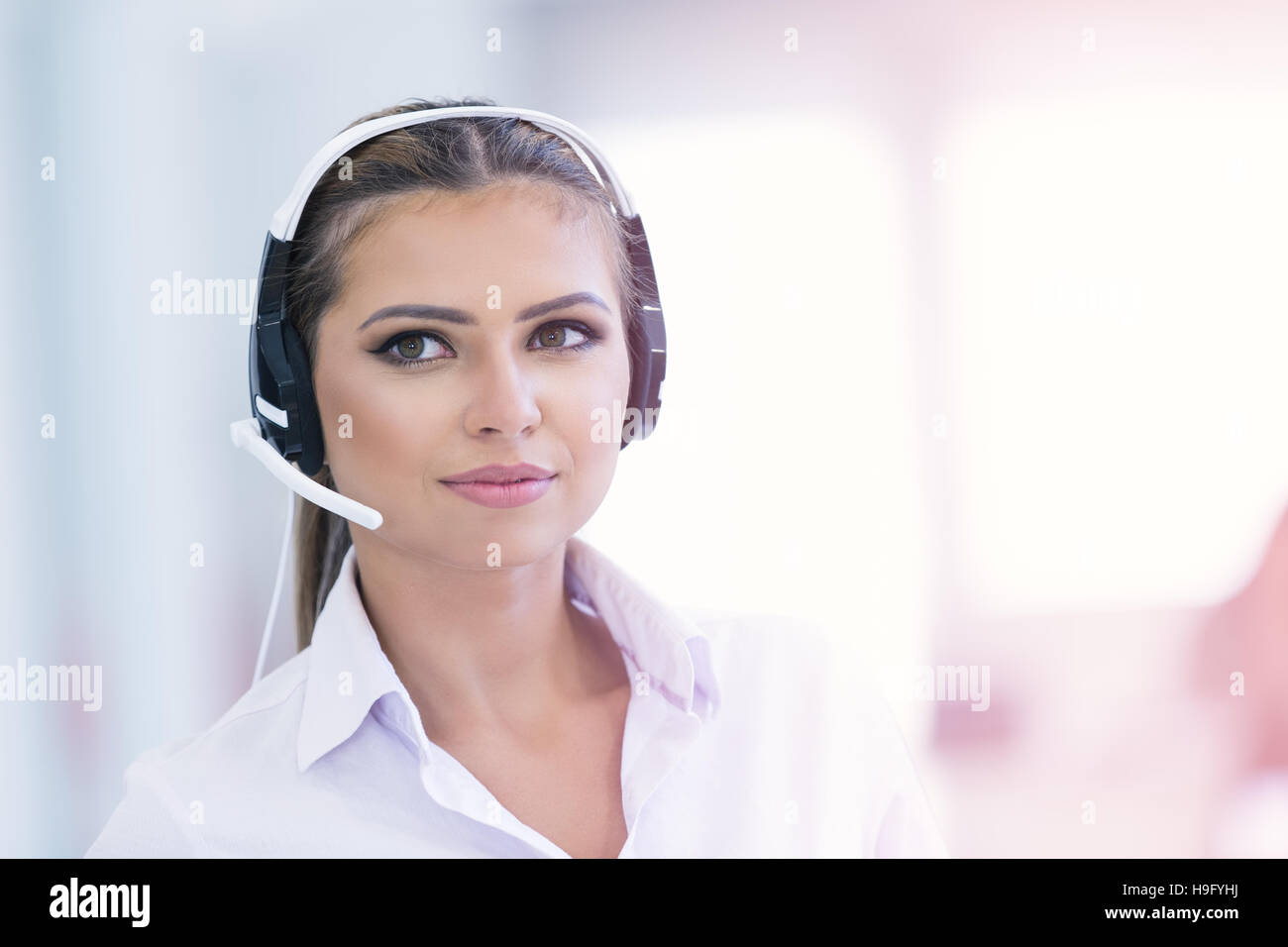 Female customer support operator with headset and smiling Stock Photo - Alamy