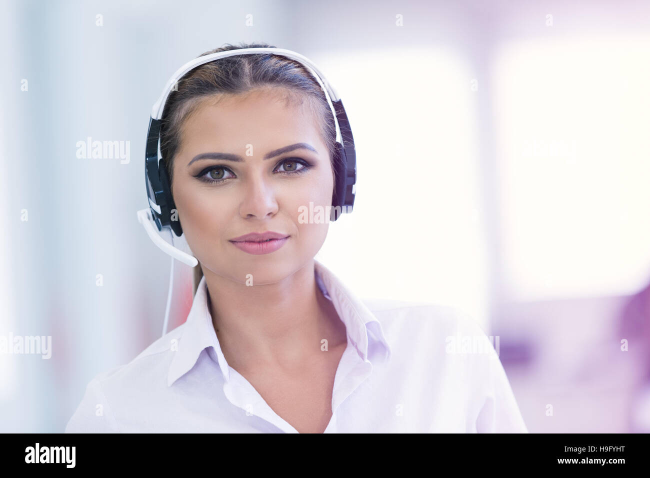 Female customer support operator with headset and smiling Stock Photo ...