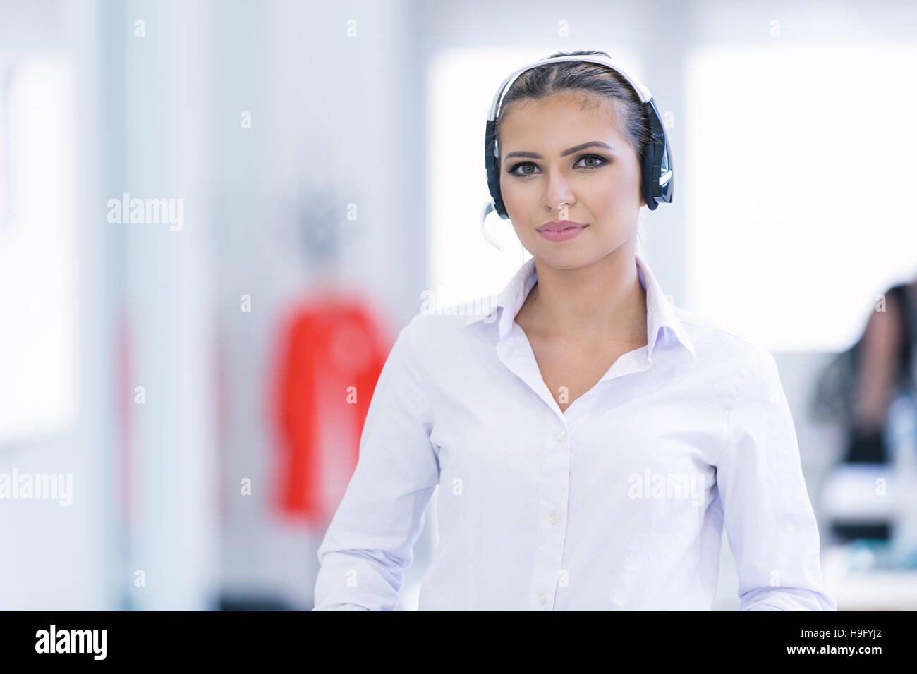 Female customer support operator with headset and smiling Stock Photo ...