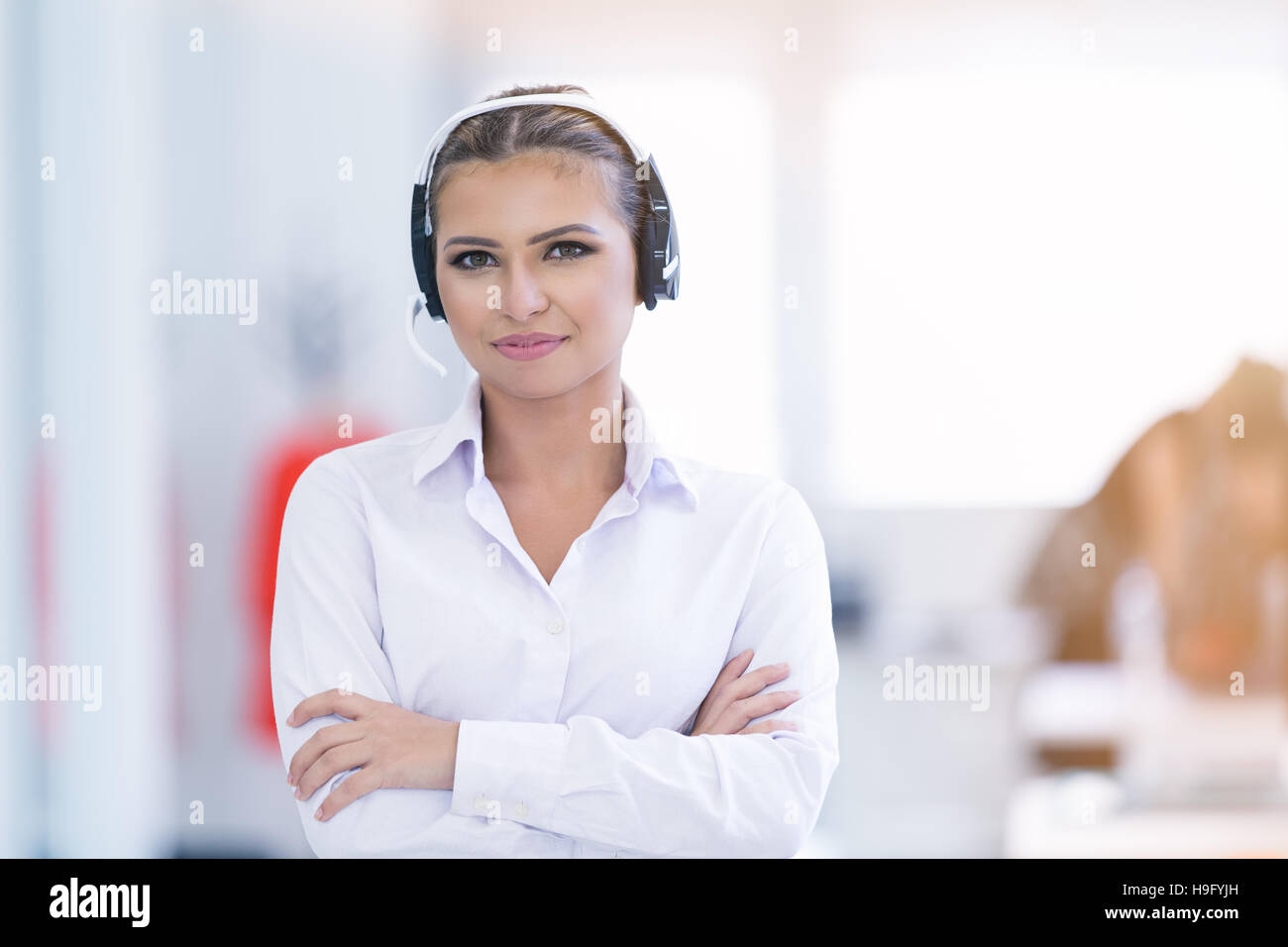 Female customer support operator with headset and smiling Stock Photo - Alamy