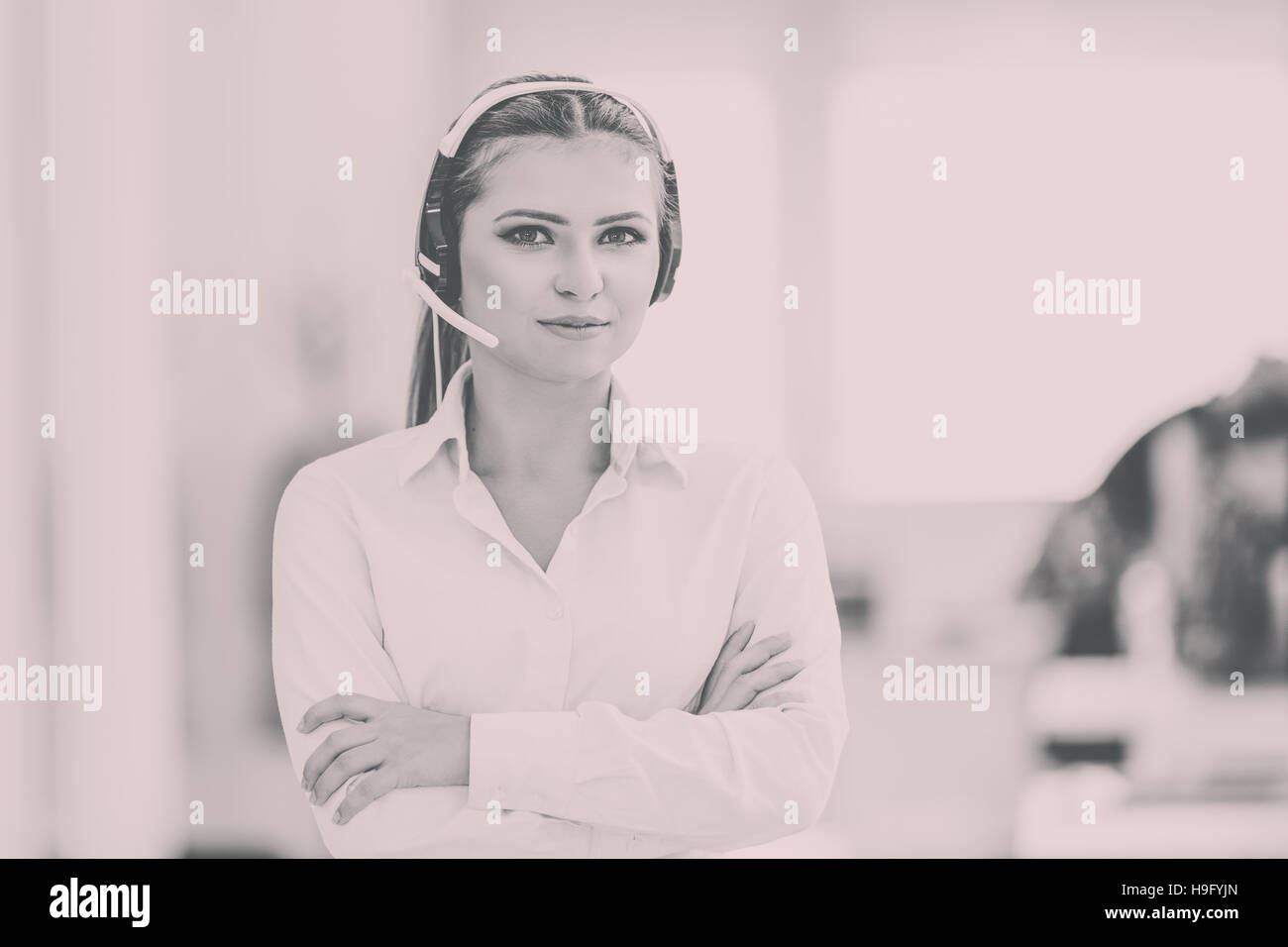 Female customer support operator with headset and smiling Stock Photo - Alamy