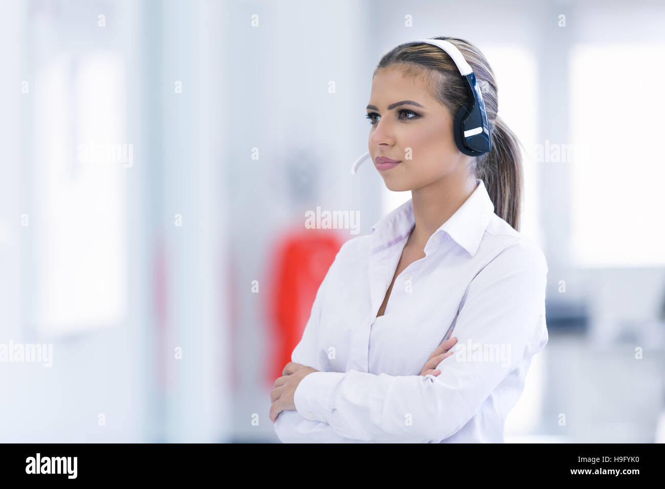 Female customer support operator with headset and smiling Stock Photo ...