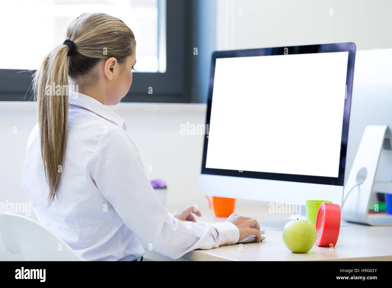 Woman working at computer in an office Stock Photo - Alamy