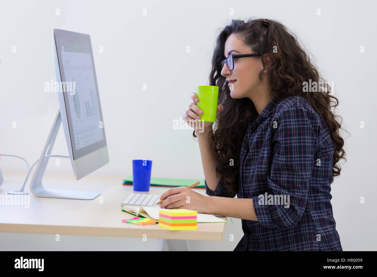 Woman working at computer in an office Stock Photo - Alamy