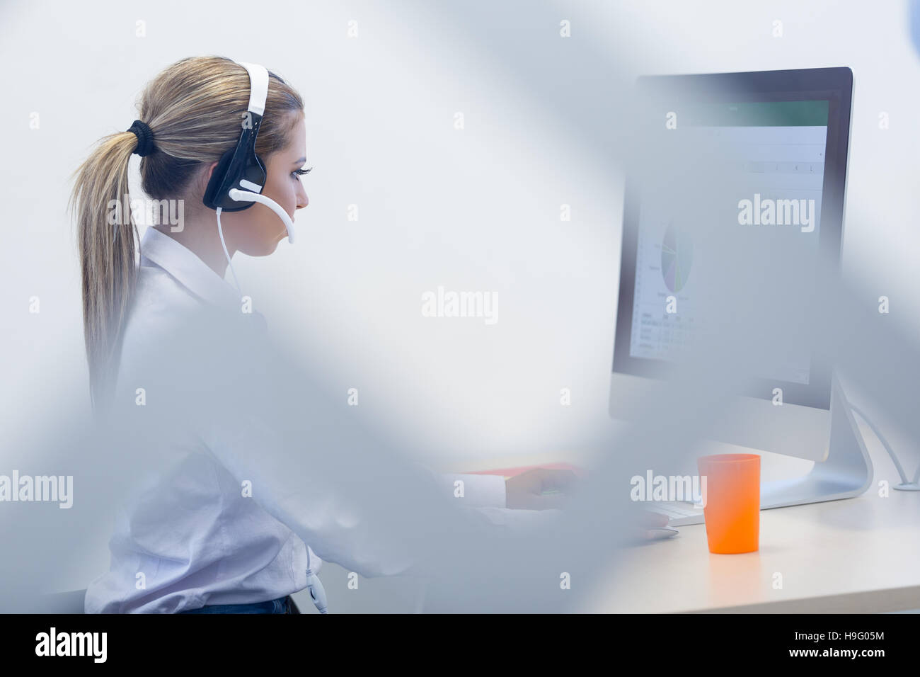 Woman working at computer in an office Stock Photo - Alamy