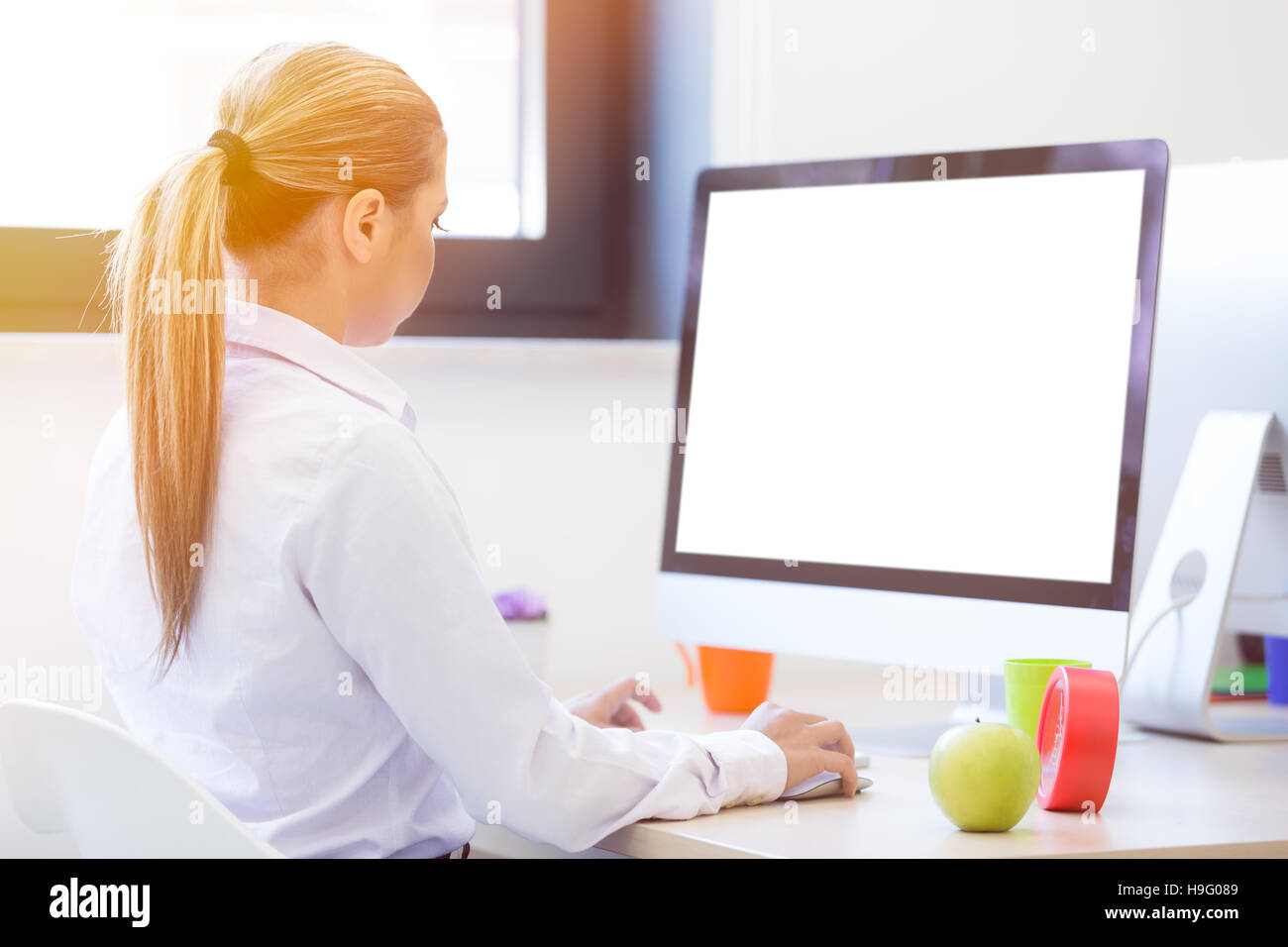 Woman working at computer in an office Stock Photo - Alamy