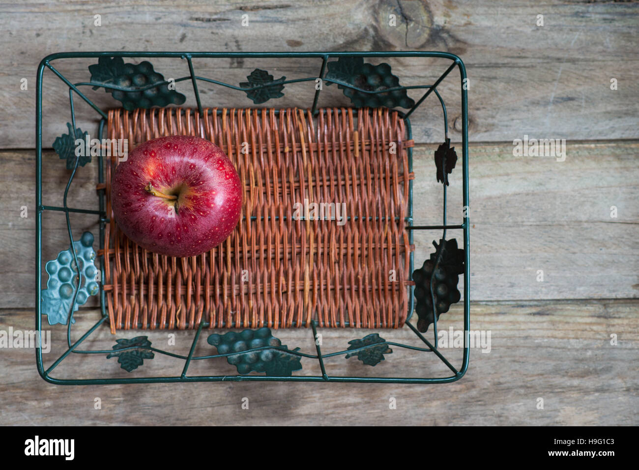 Tray with red apples on wooden table Stock Photo - Alamy