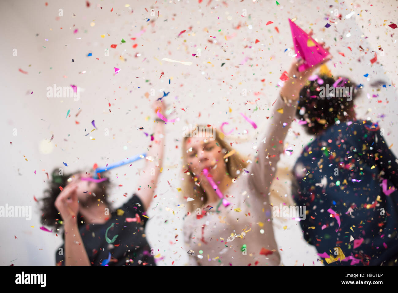 confetti party happy young people group celebrating new year eve while ...