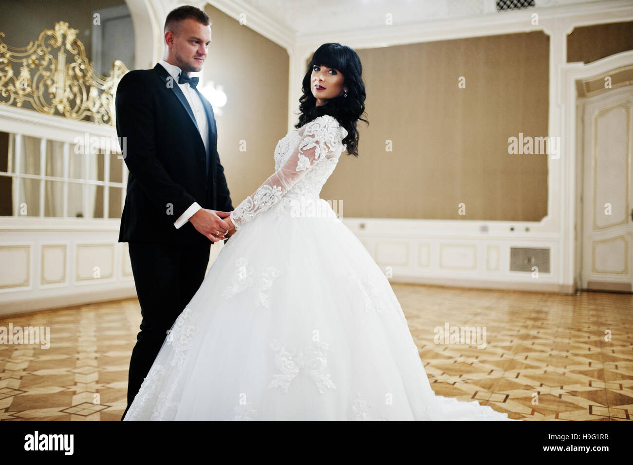 Magnificent wedding couple on royal room with many mirrors Stock Photo ...