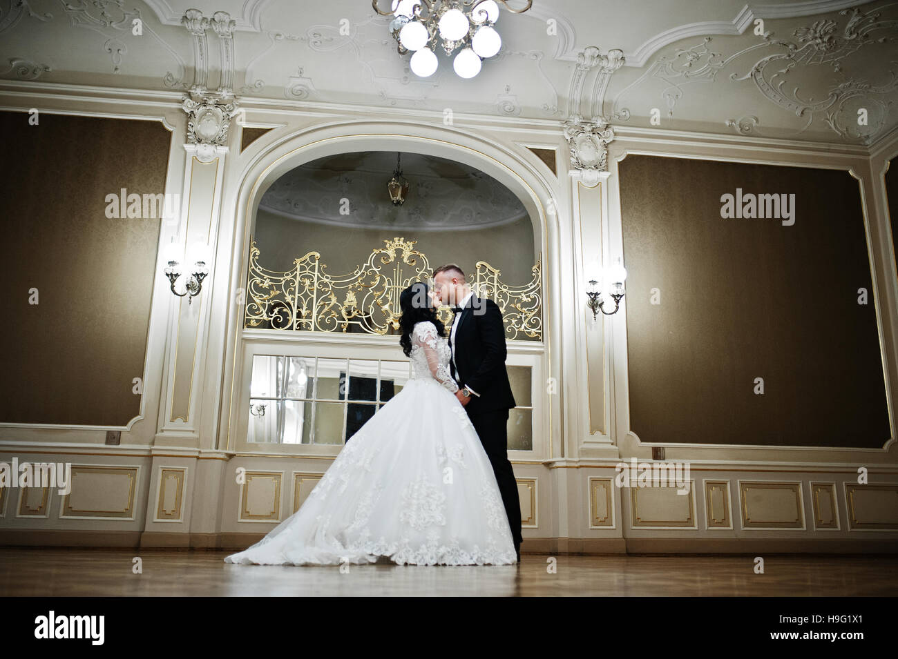 Magnificent wedding couple on royal room with many mirrors Stock Photo ...