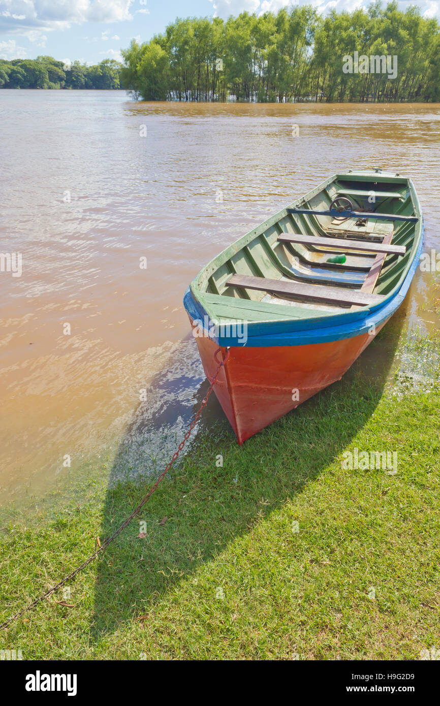 A wood boat stopped on grass with Rio Pardo river in background Stock ...