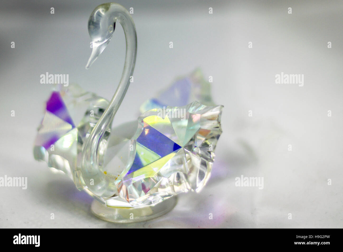 Crystal swan in white background Stock Photo - Alamy