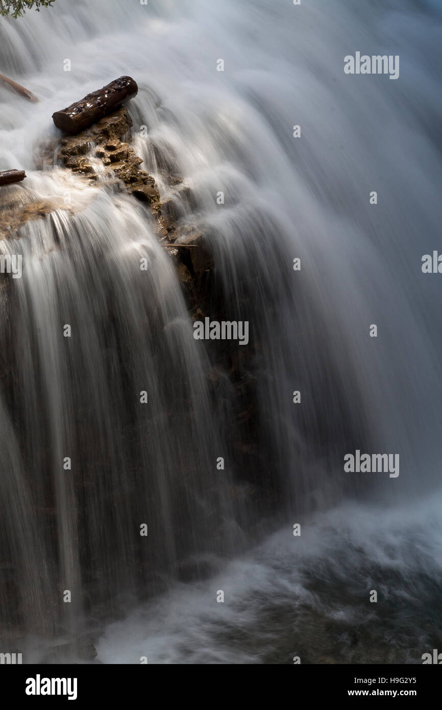 Log in a water fall river in Jasper national Park Canada Stock Photo ...