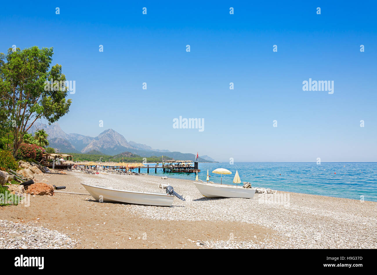 Small motor boat on the beach. Boat moored on the sand by the sea Stock ...