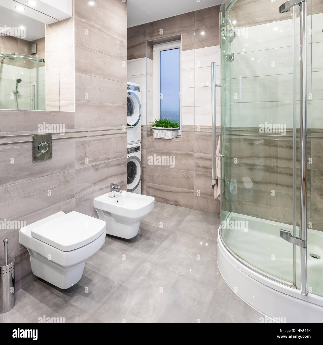 Spacious high-gloss bathroom with mirror, toilet, bidet, shower, washer ...