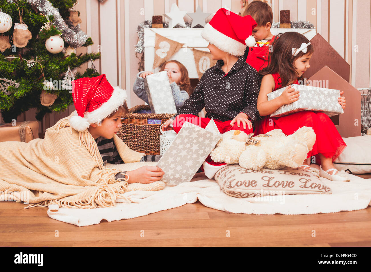 Two boys wearing Santa caps Stock Photo - Alamy