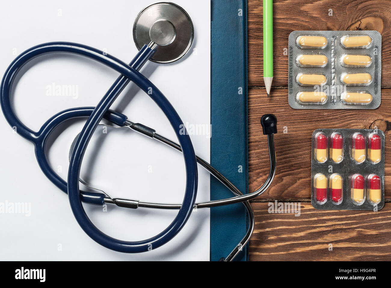 Desk of doctor with medicine things Stock Photo - Alamy