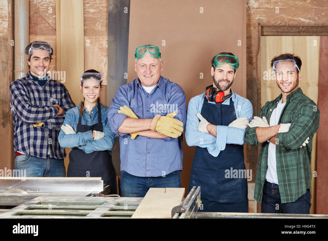 Carpenters team standing proud as a group Stock Photo - Alamy