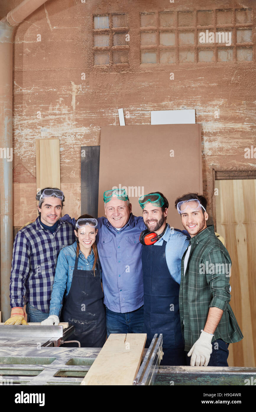Team at carpentry workshop with boss Stock Photo - Alamy