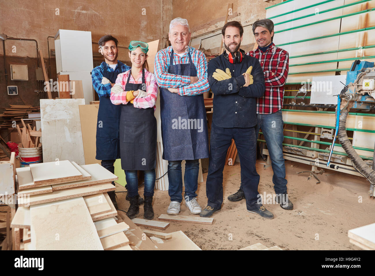 Team of carpenters with their boss at work Stock Photo - Alamy