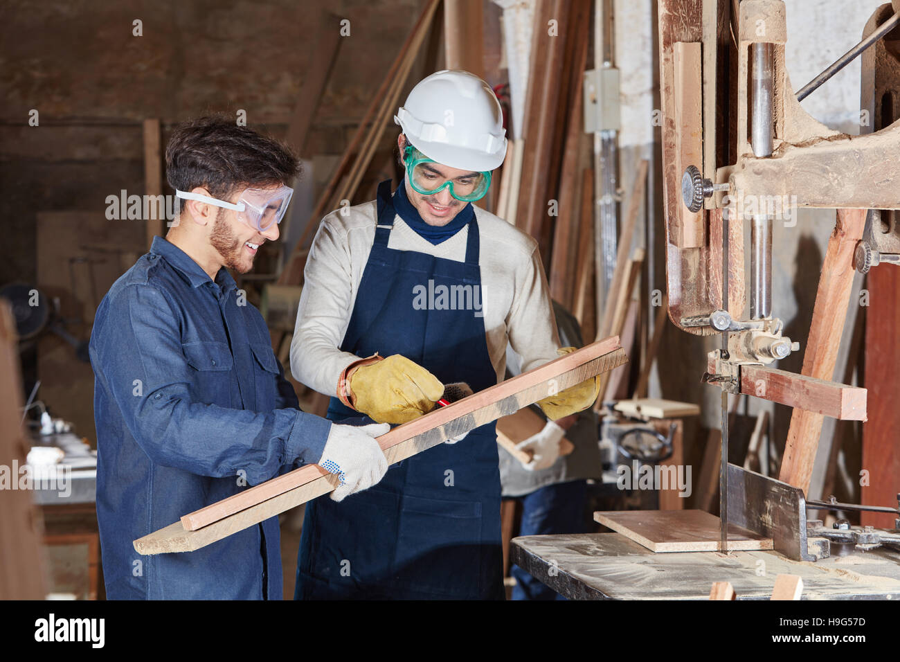 Carpentry apprentice during lesson of wood processing Stock Photo - Alamy