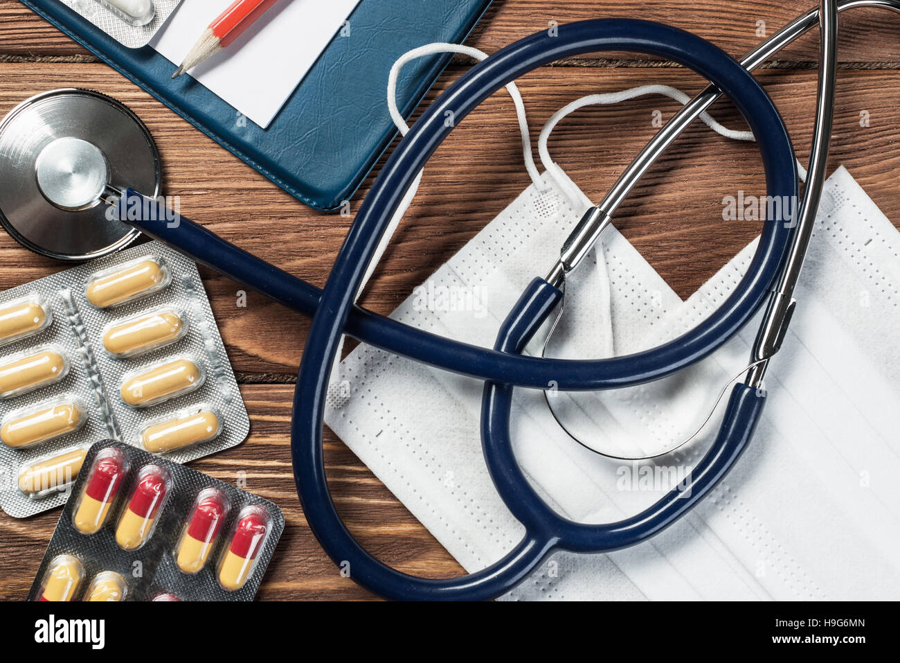 Desk of doctor with medicine things Stock Photo - Alamy