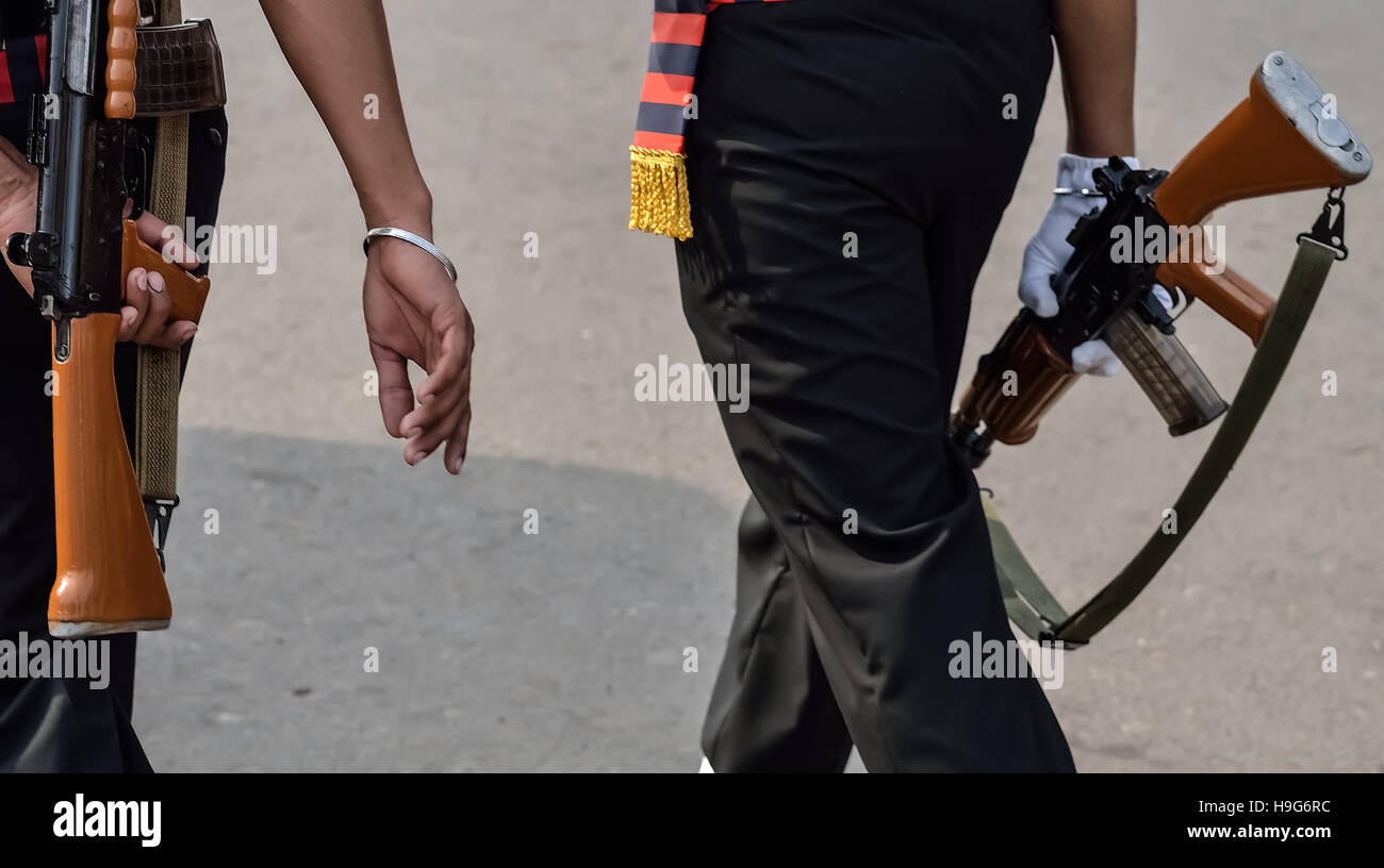 Security men are walking with gun Stock Photo - Alamy