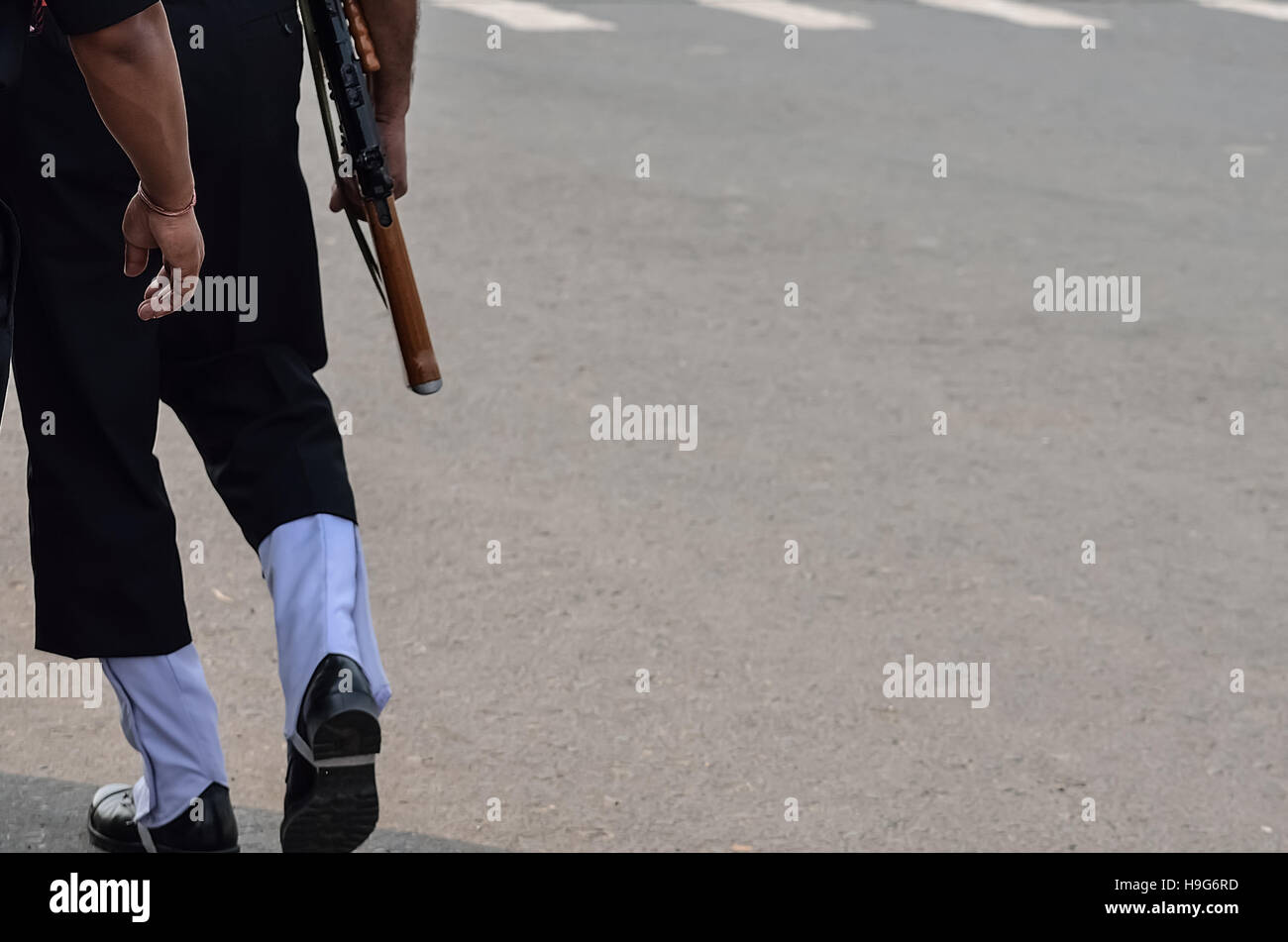 Security men are walking with gun Stock Photo - Alamy
