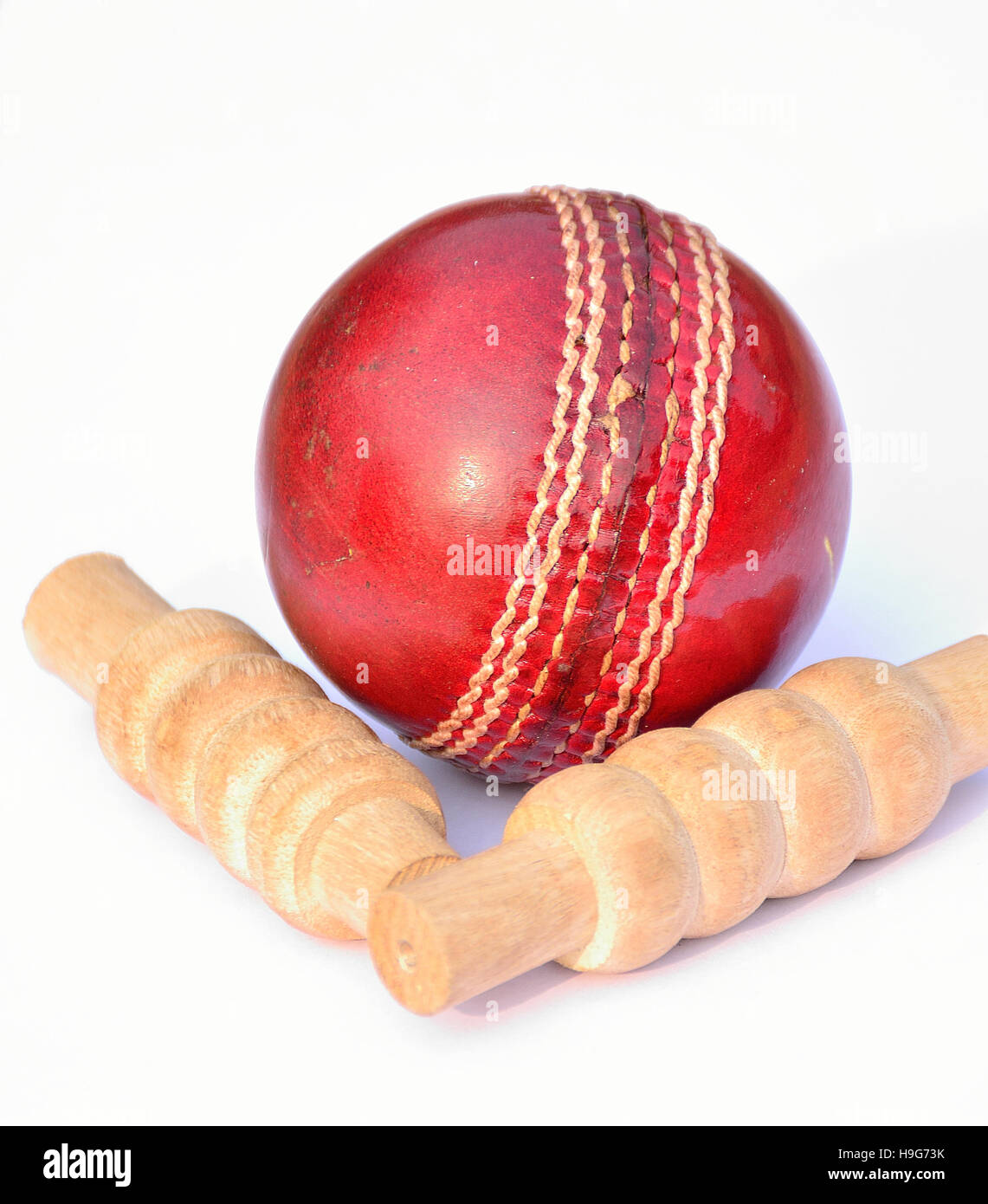 Cricket ball and bails with a shadow on a white background Stock Photo ...