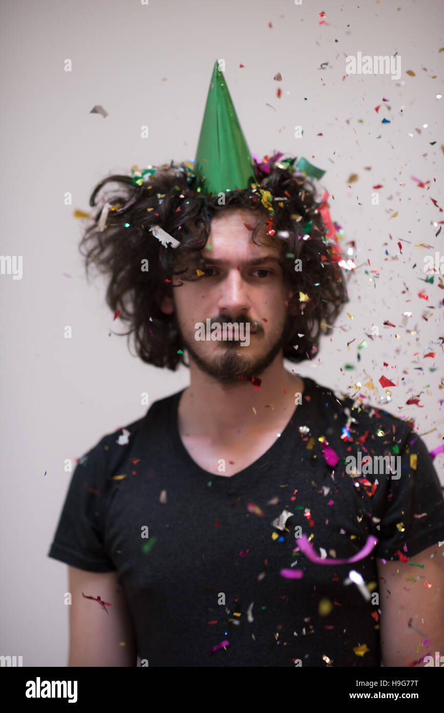 young man on party celebrating new year with falling confetti Stock ...