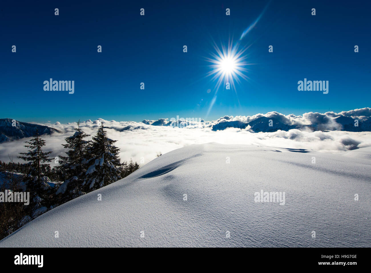 Big snowfall in the Alps landscape with clouds in the valley Stock ...