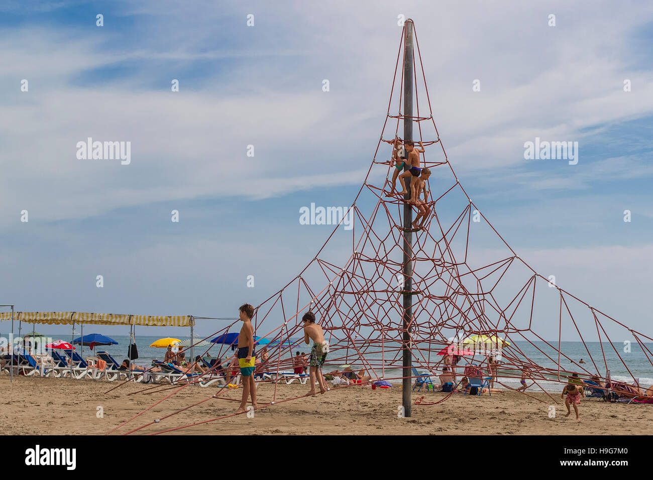 Sports tourists play on the beach, Spain Stock Photo - Alamy