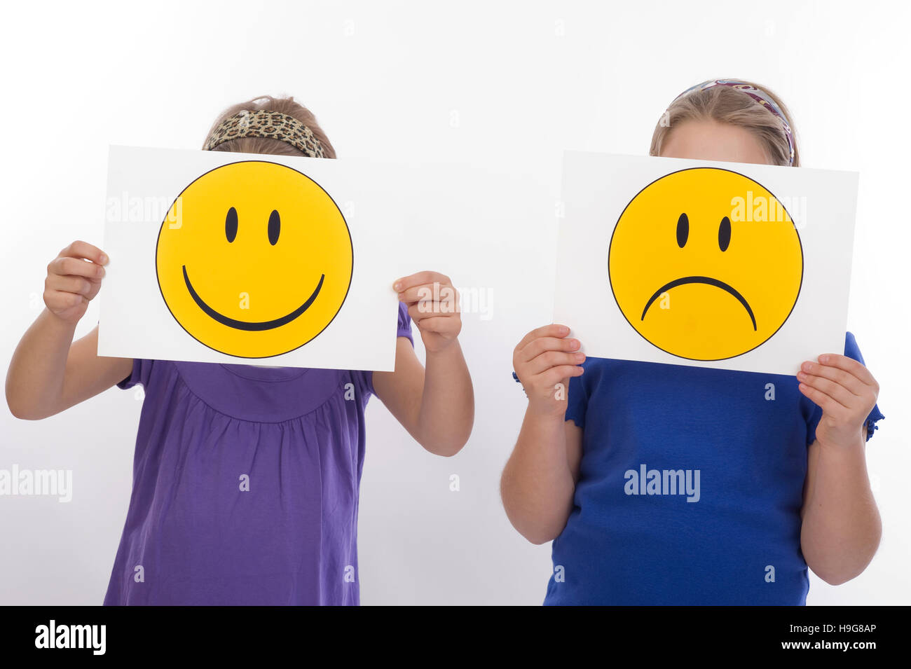 Sad and happy child, symbolic picture Stock Photo - Alamy