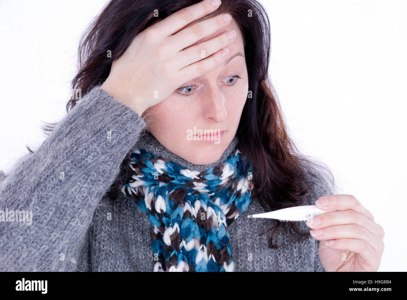 Woman measures temperature thermometer hi-res stock photography and ...