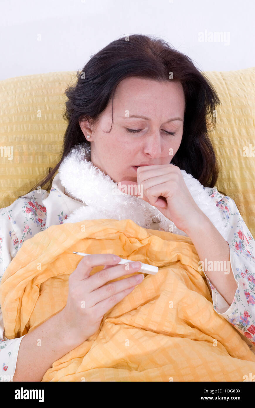 Young woman in bed with fever Stock Photo - Alamy