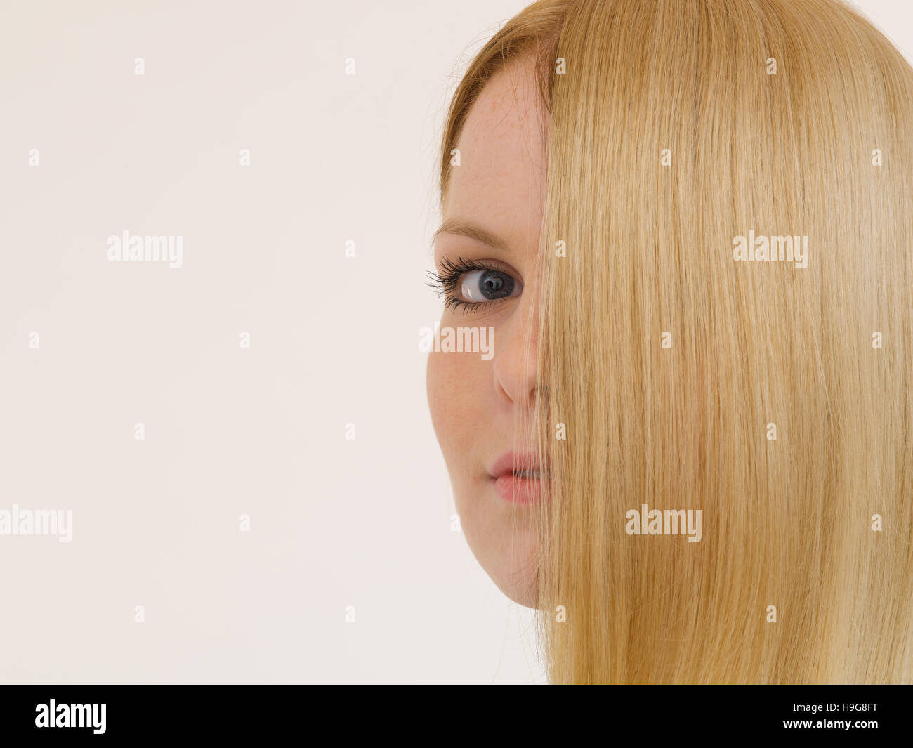 Woman half young face half old face hi-res stock photography and images ...