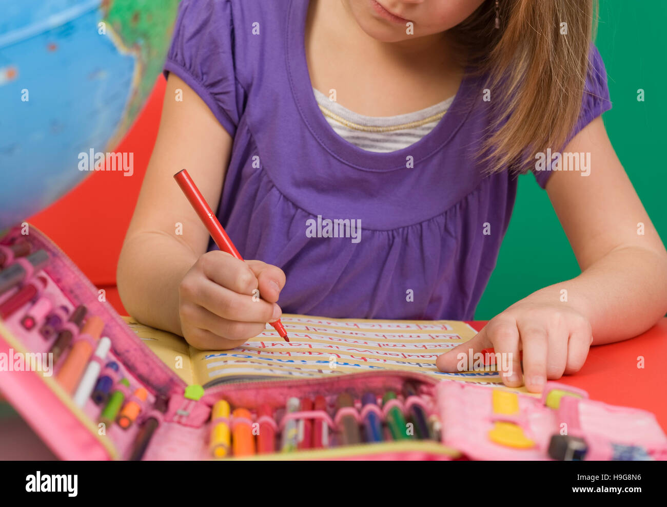 Girl, 6 years old, doing her homework Stock Photo - Alamy